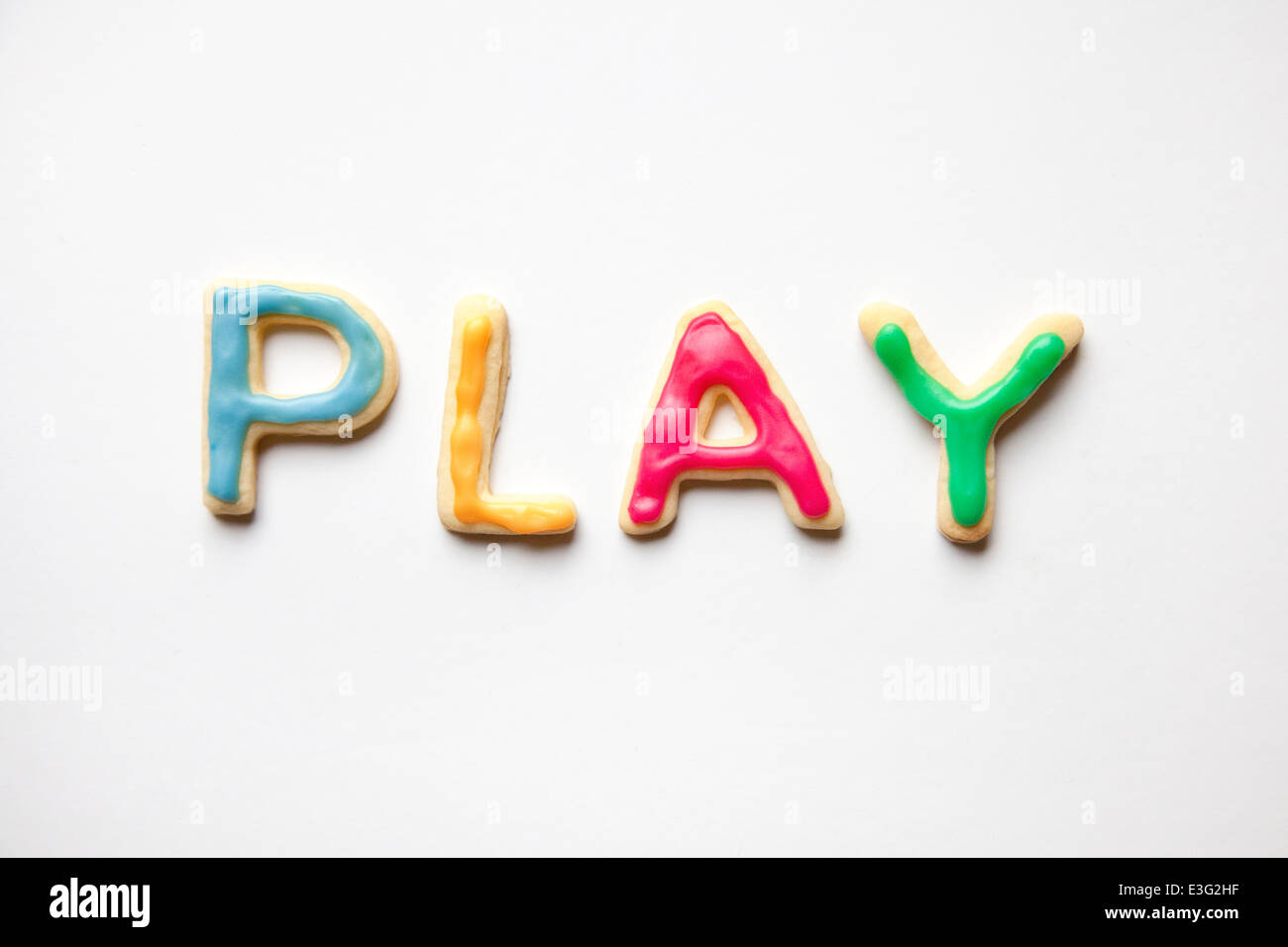 Decorated cookies PLAY on white Stock Photo - Alamy