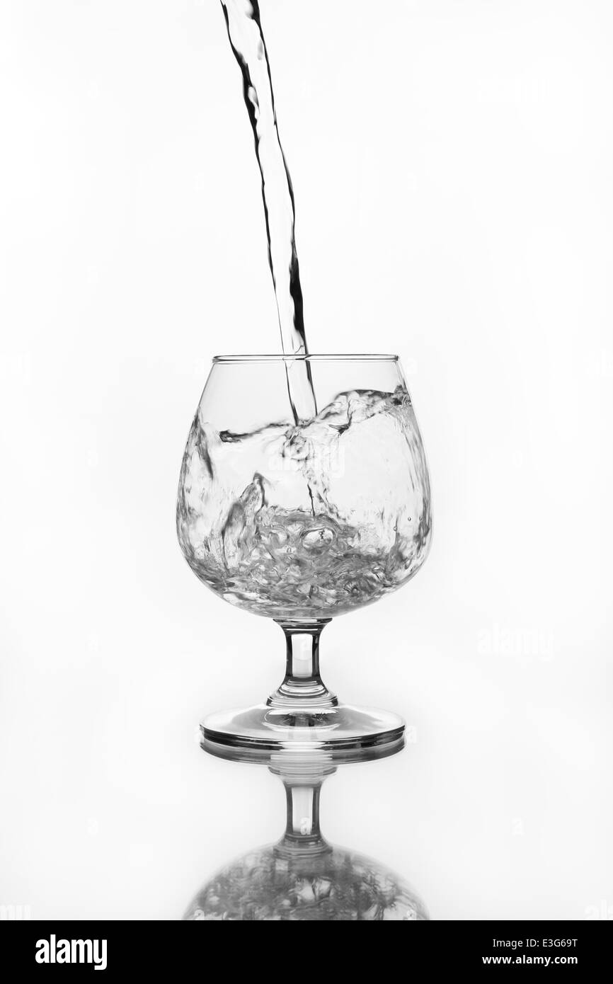 wine glass with water pouring (gray scale Stock Photo - Alamy