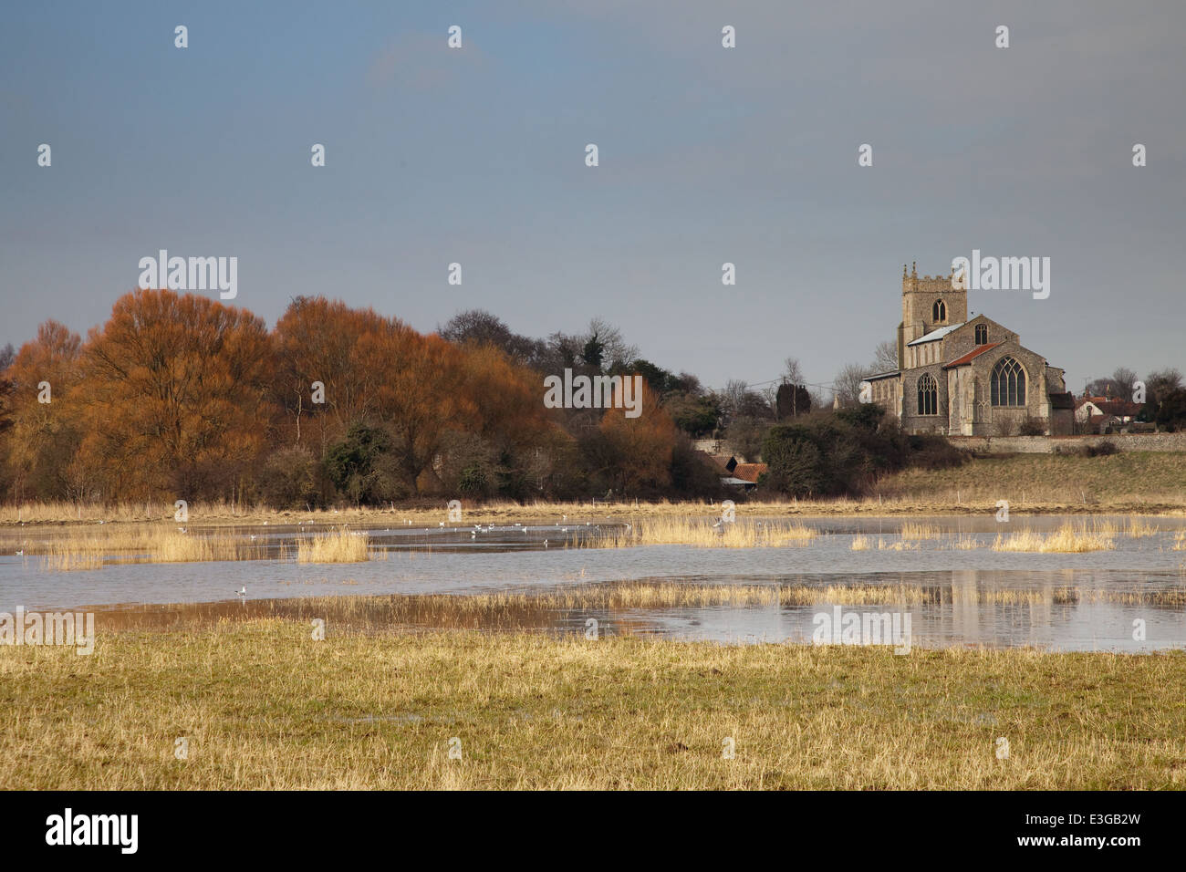 Wiveton Church, Norfolk reflected in the flooded water meadows Stock ...