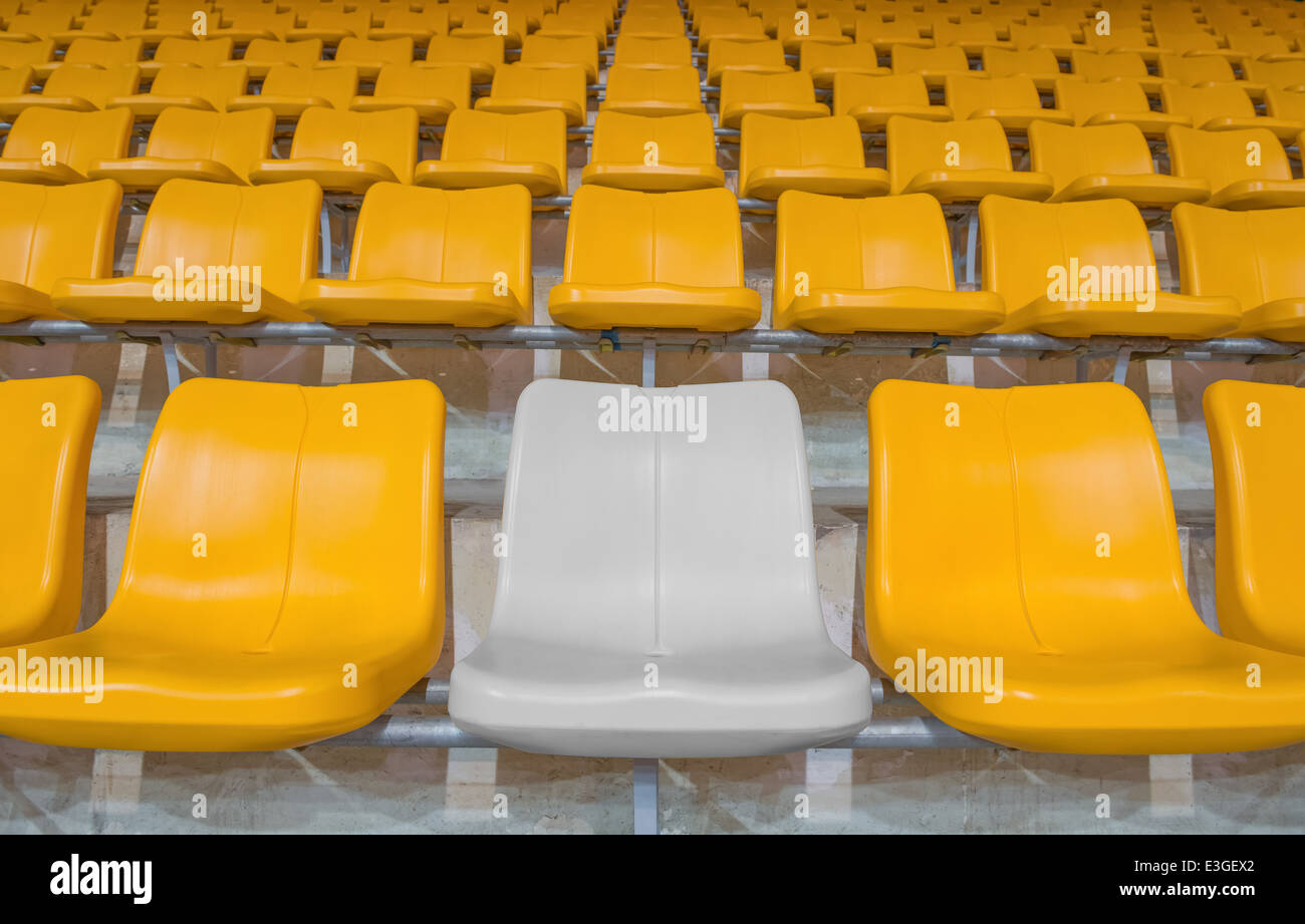 highlighted yellow stadium seat Stock Photo - Alamy