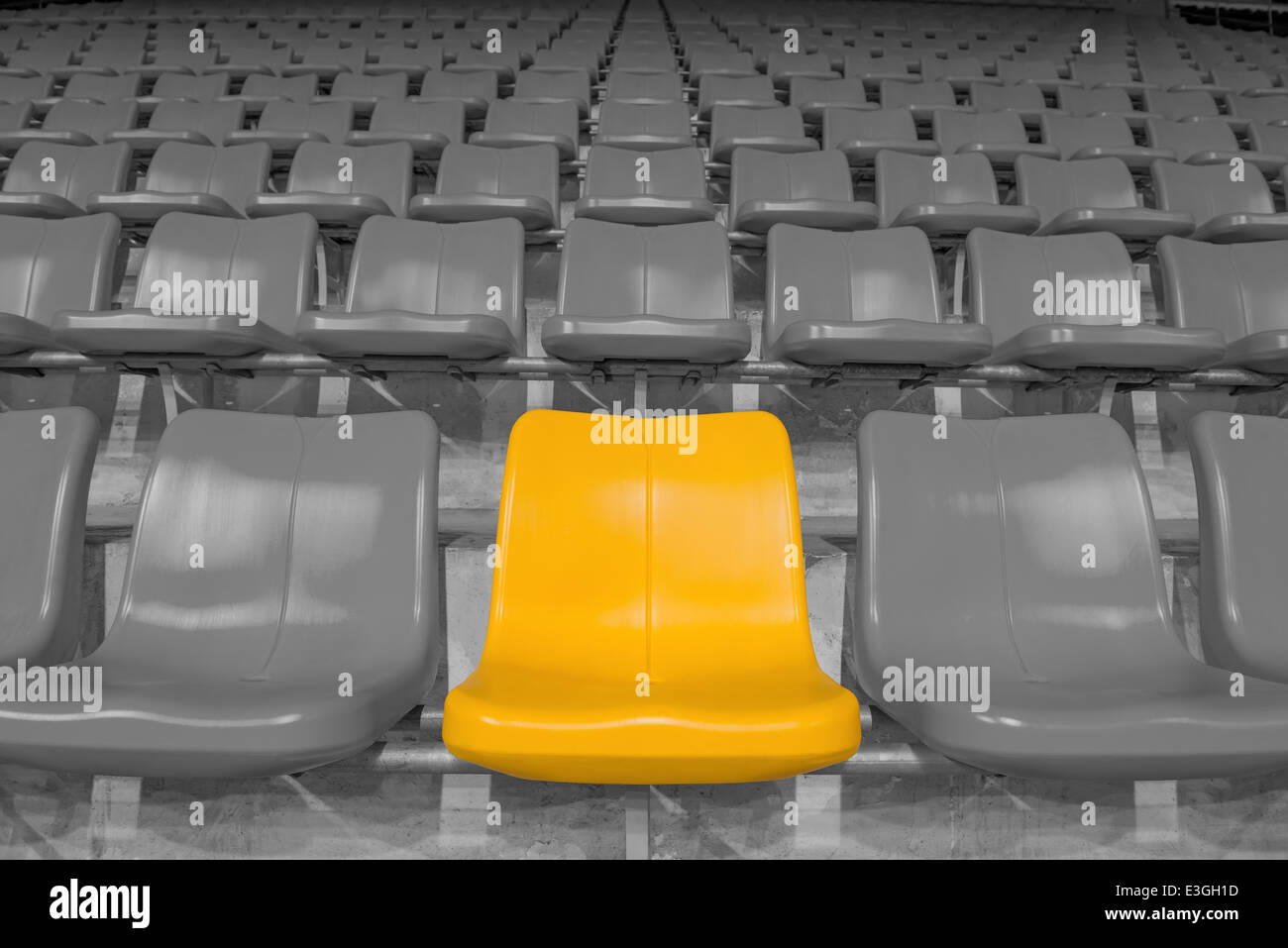 highlighted yellow stadium seat Stock Photo - Alamy
