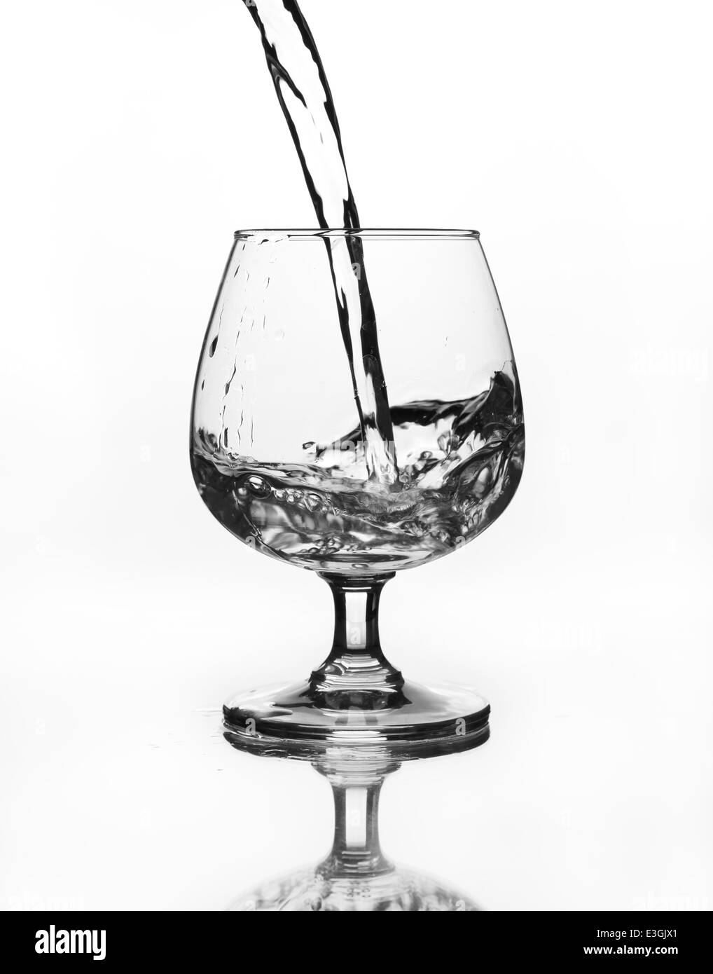 wine glass with water pouring (gray scale Stock Photo - Alamy
