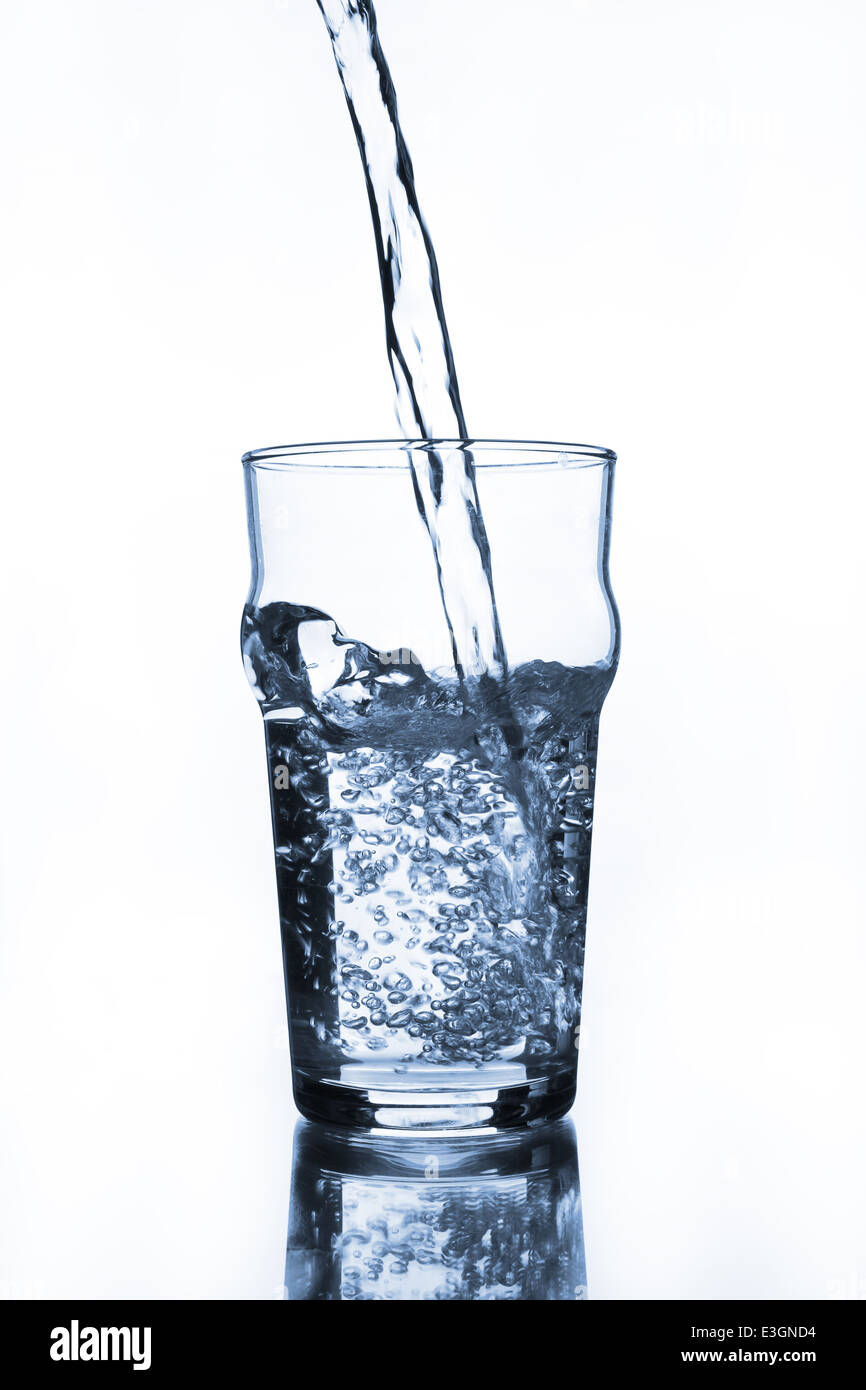 glass with water pouring with shadow Stock Photo - Alamy