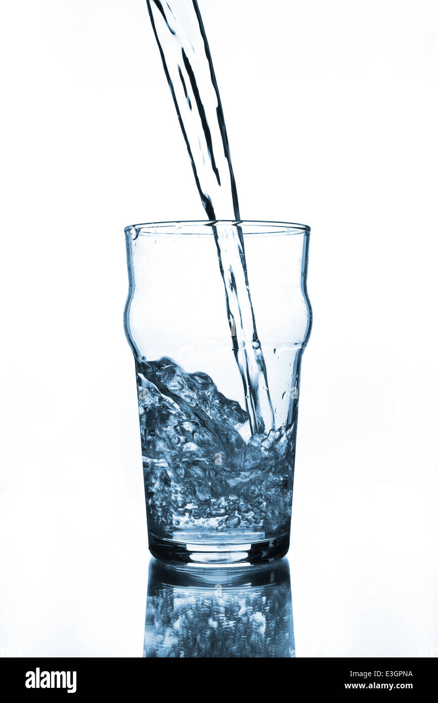glass with water pouring with shadow Stock Photo - Alamy