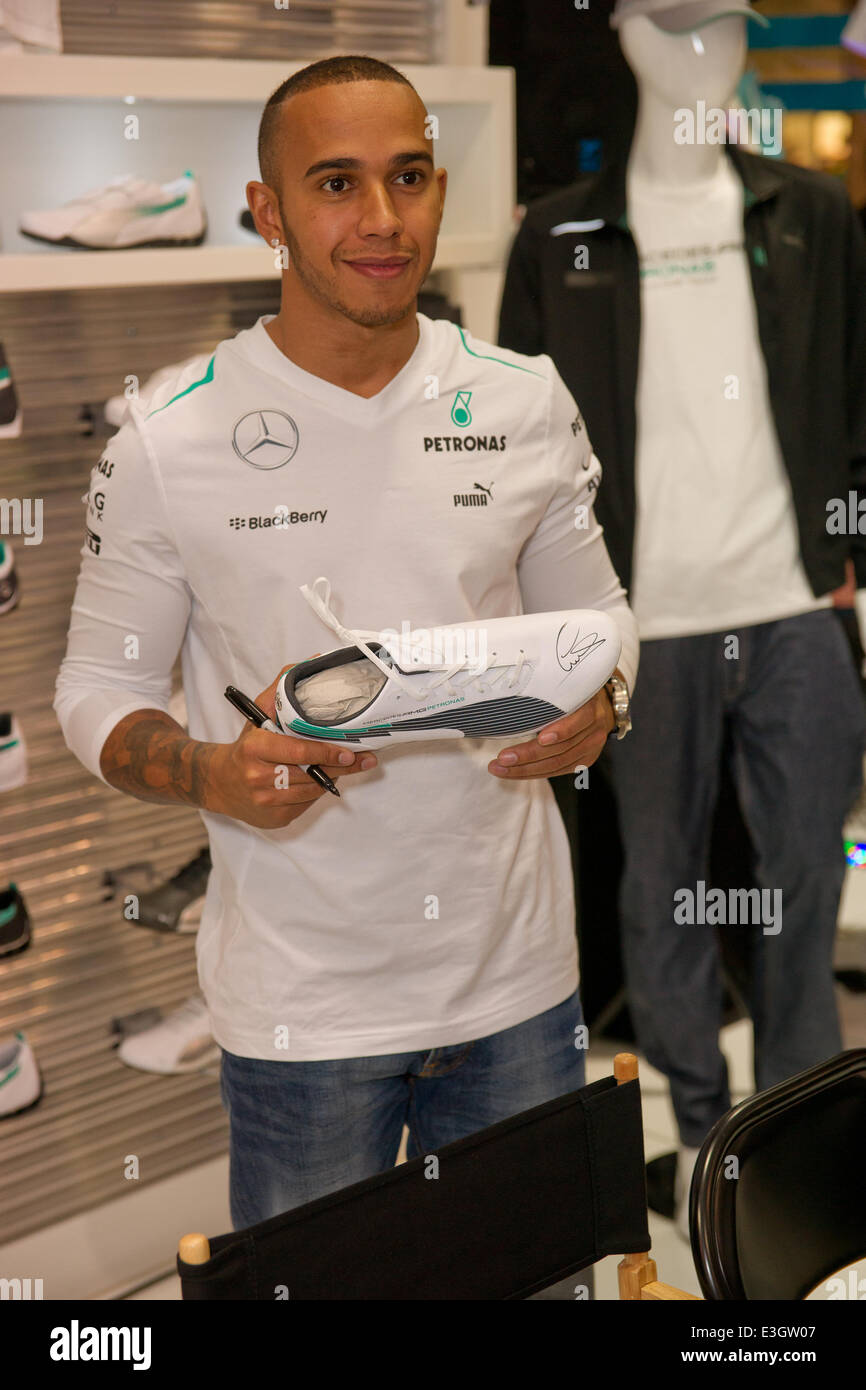 Lewis Hamilton signs autographs for Formula 1 fans at Shoe Palace at ...