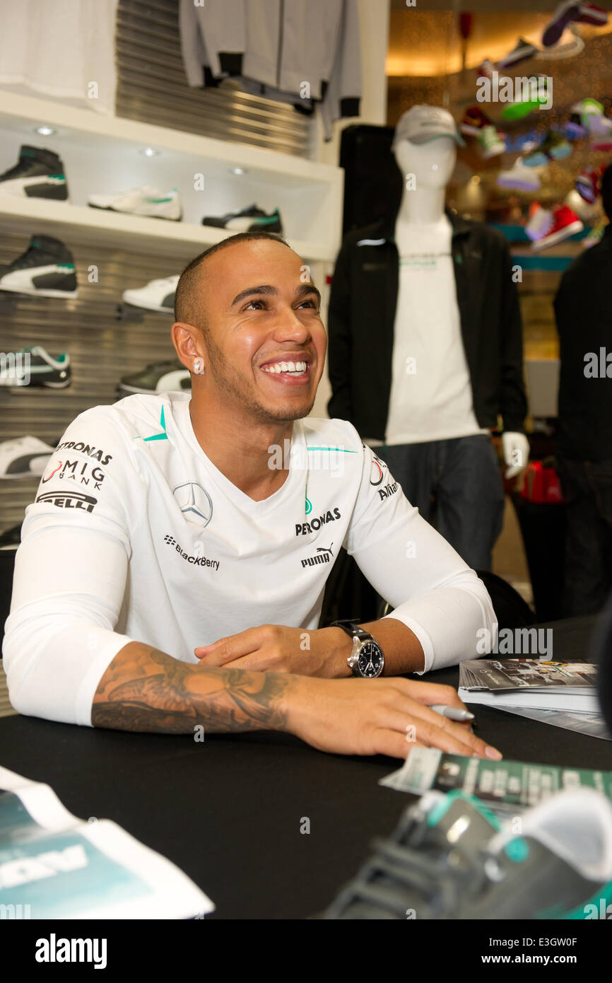 Lewis Hamilton signs autographs for Formula 1 fans at Shoe Palace at ...