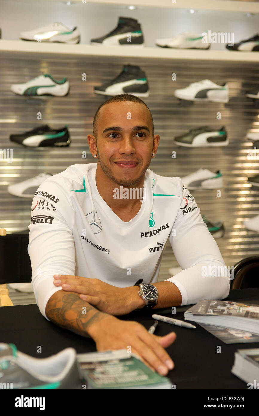 Lewis Hamilton signs autographs for Formula 1 fans at Shoe Palace at ...