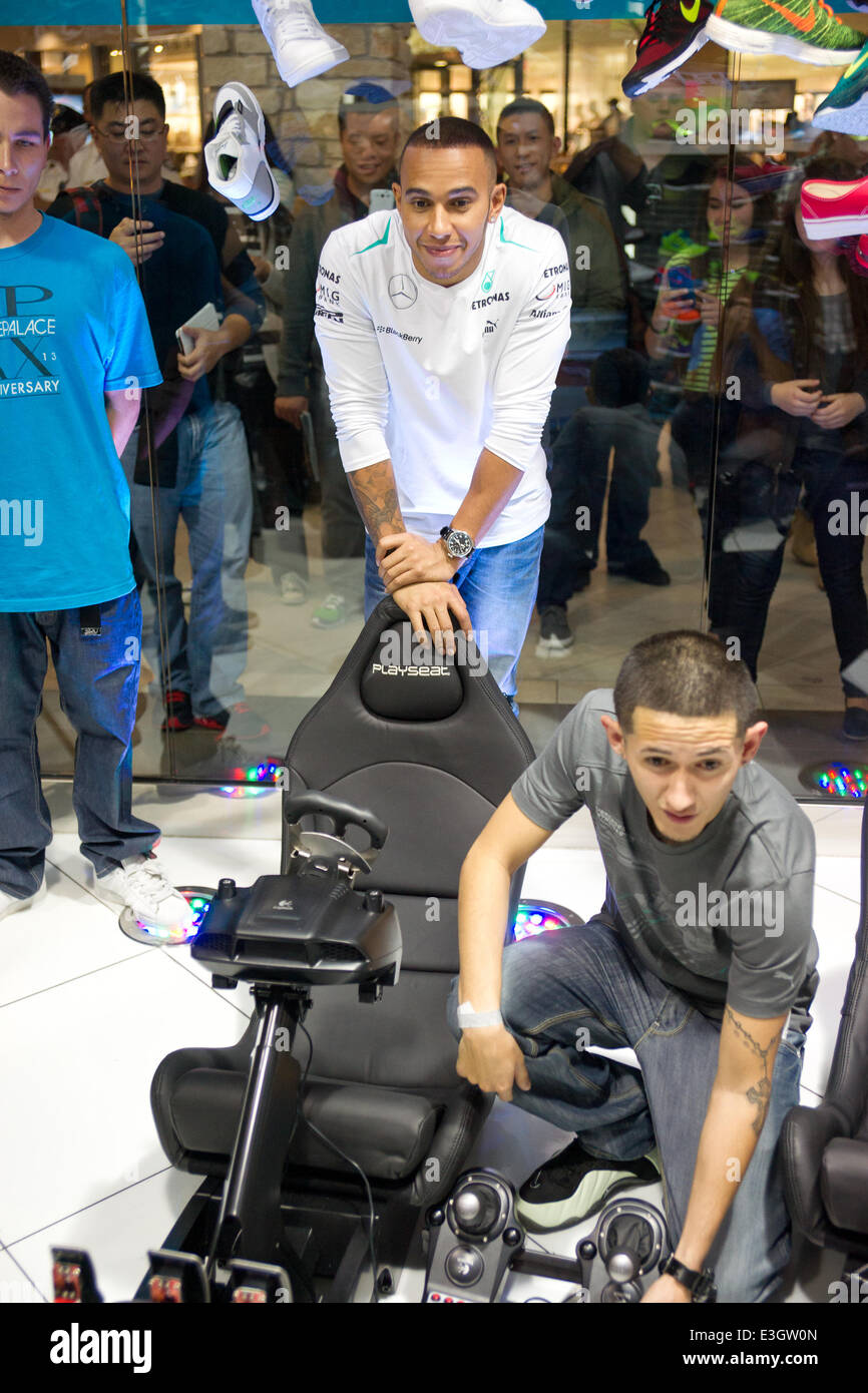Lewis Hamilton signs autographs for Formula 1 fans at Shoe Palace at ...