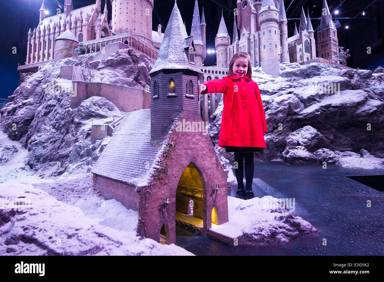 Local schoolgirl Robyn adds some of the last sprinkles of snow to the ...