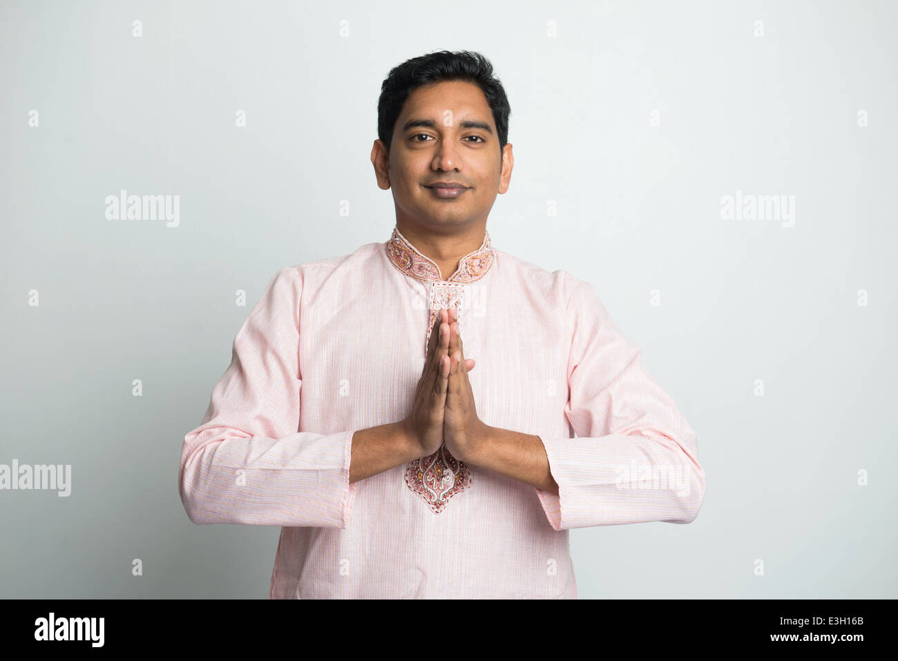 traditional young indian male with Pranamasana greetings sign on ...