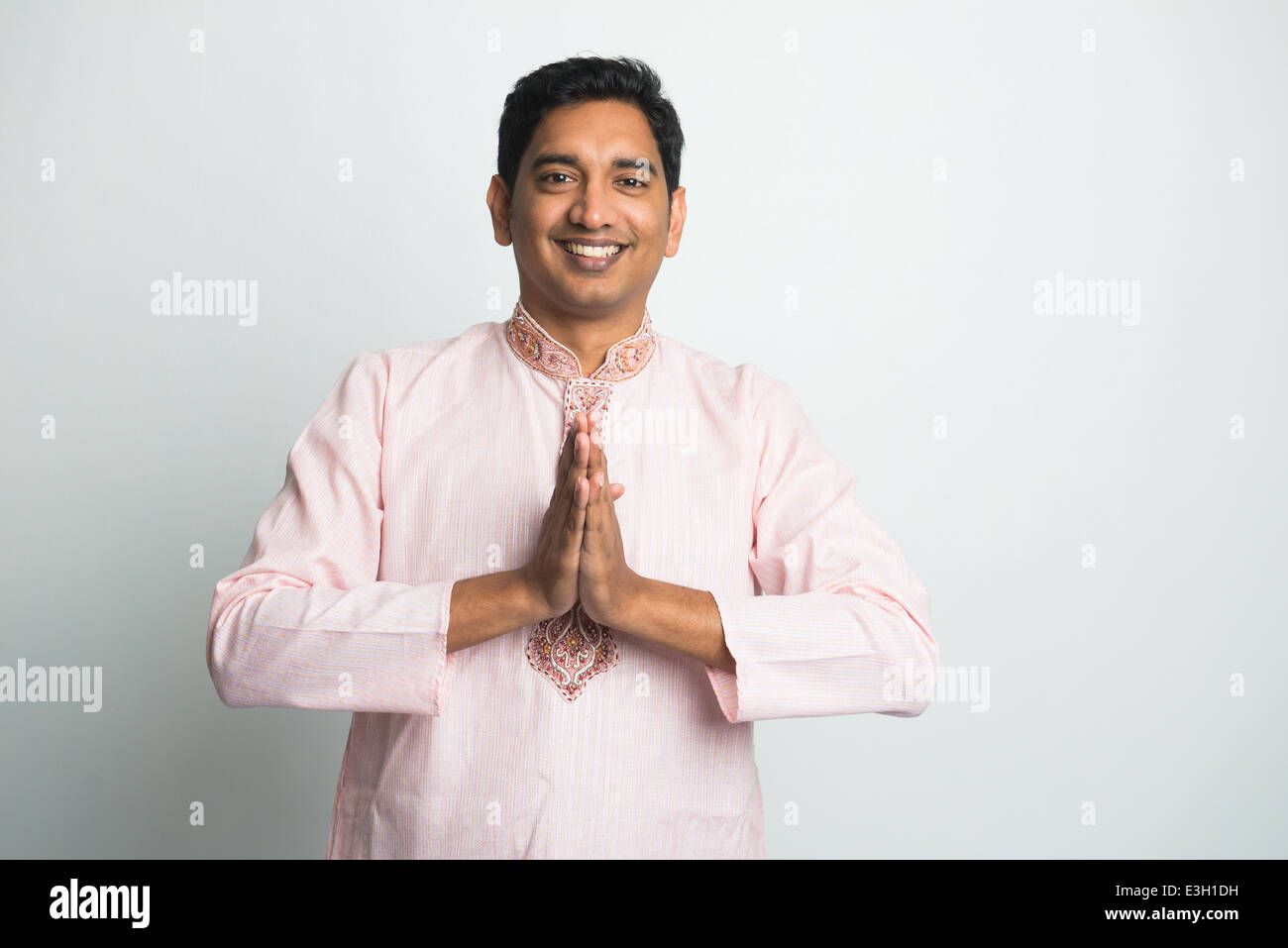 traditional young indian male with Pranamasana greetings sign on ...