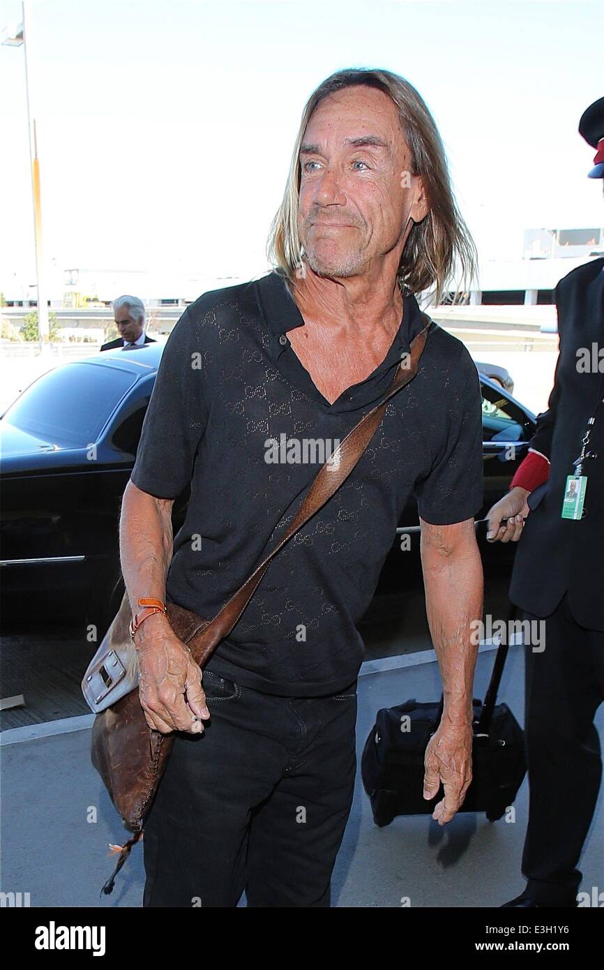 Iggy Pop running late at LAX and he quickly waves hello and goodbye at ...