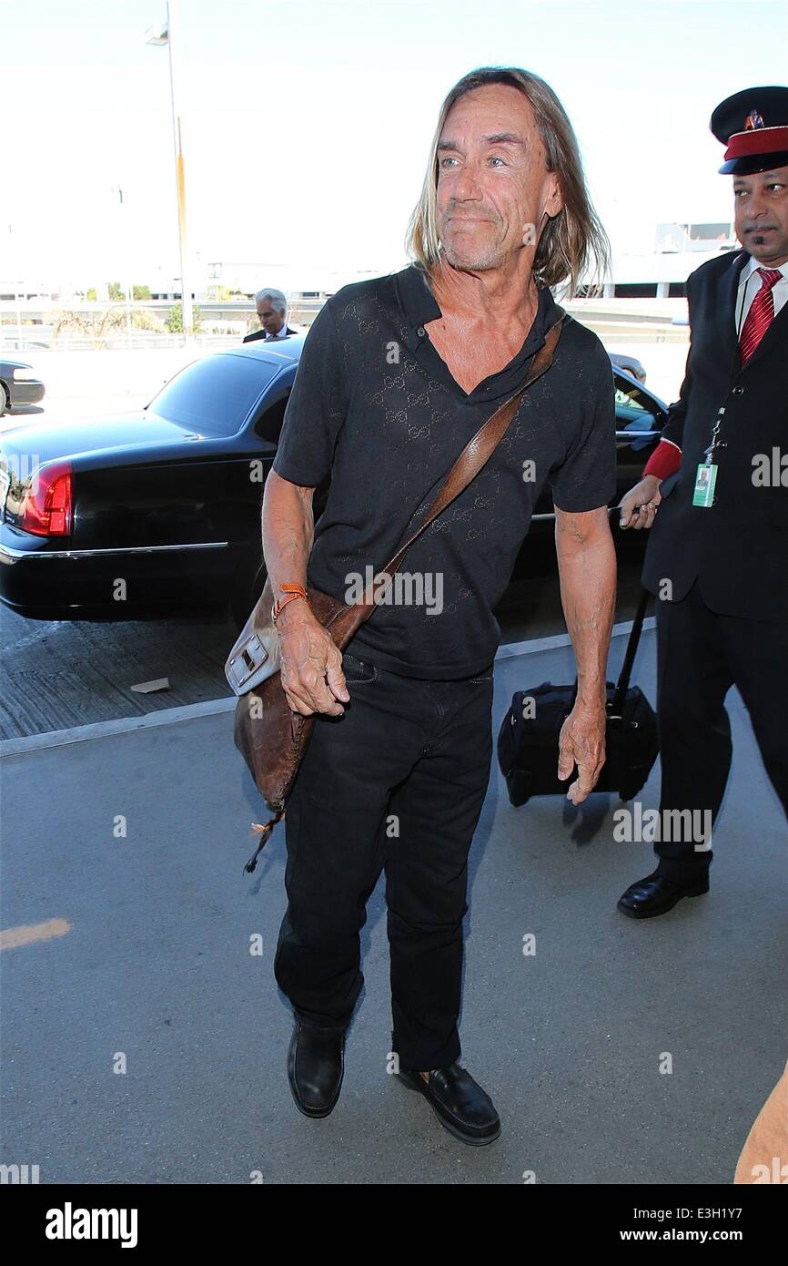 Iggy Pop running late at LAX and he quickly waves hello and goodbye at ...