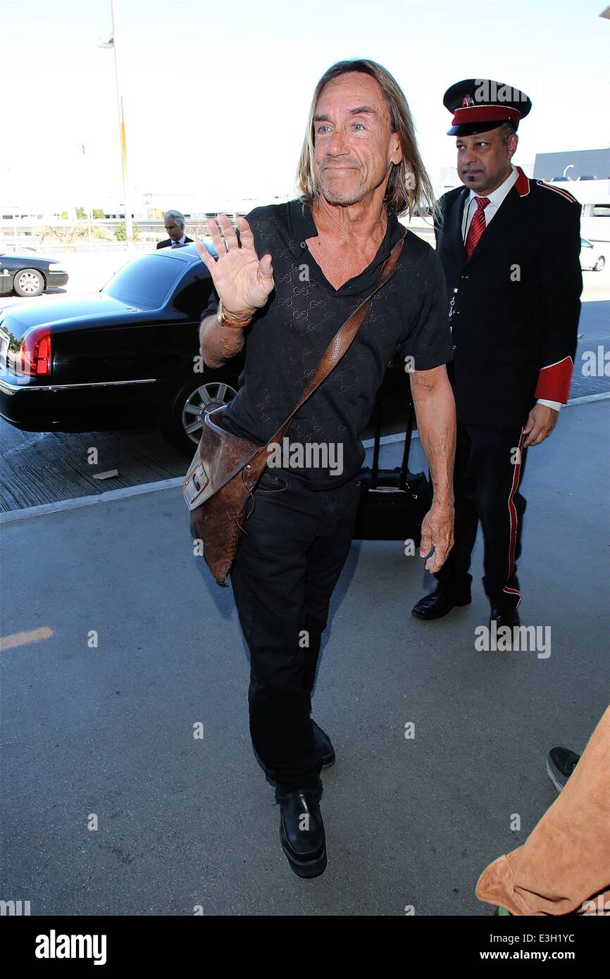 Iggy Pop running late at LAX and he quickly waves hello and goodbye at ...