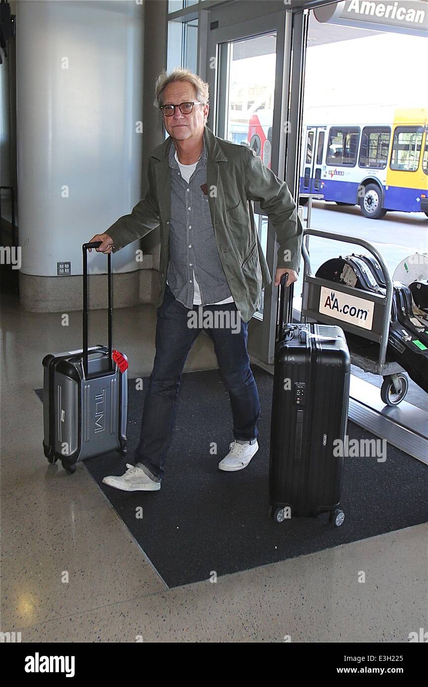 America member Gerry beckley leaves Los Angeles At LAX , as he lugs his ...