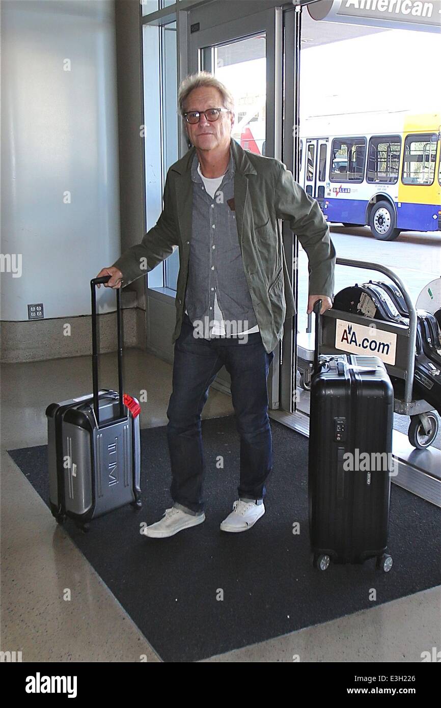 America member Gerry beckley leaves Los Angeles At LAX , as he lugs his ...