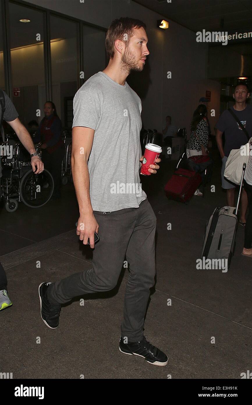 Calvin Harris arrives at LAX airport carrying a cup of coffee Featuring ...