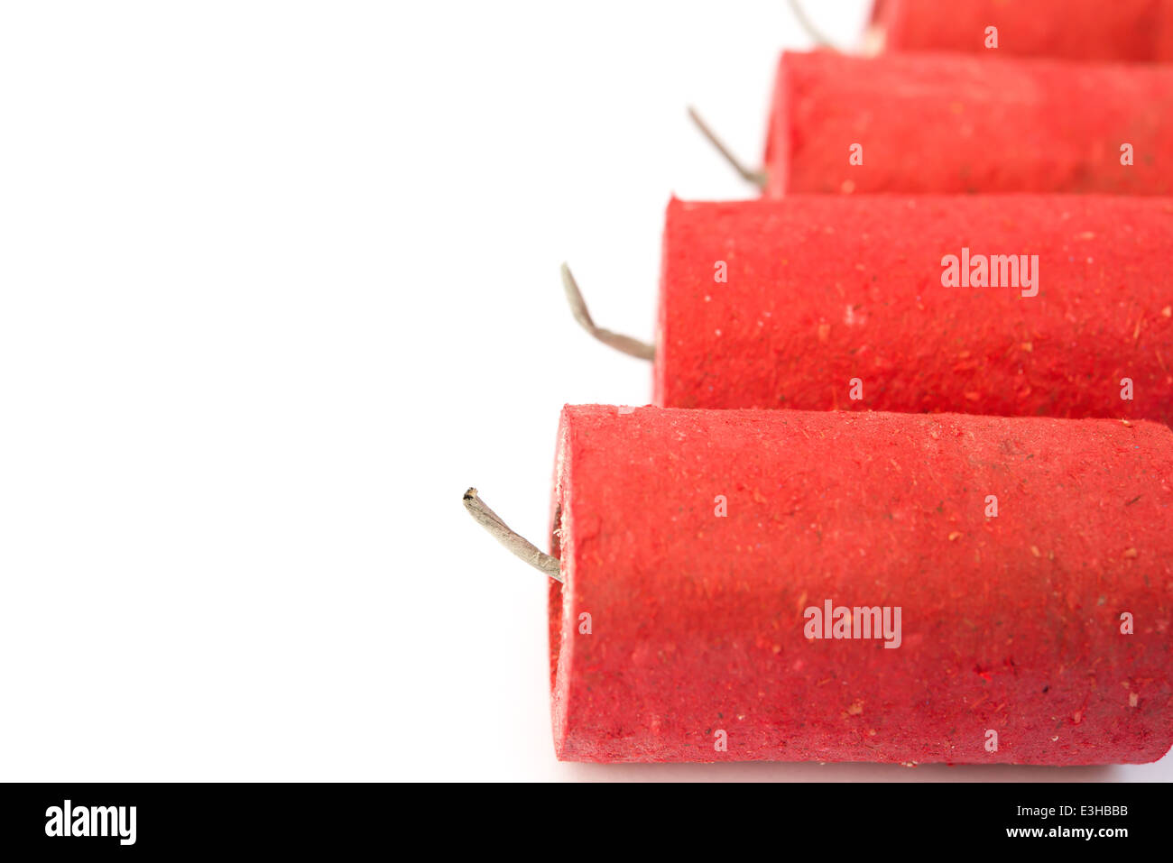 red firecrackers on a white background with copy space Stock Photo - Alamy