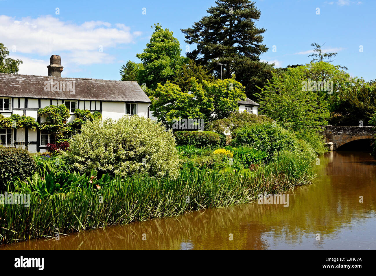 River Arrow with a pretty black and white timbered cottage to the rear ...