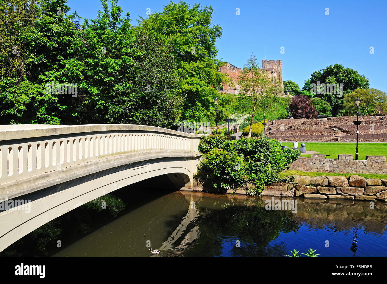 Footbridge over River Anker with the Norman castle and gardens to the ...