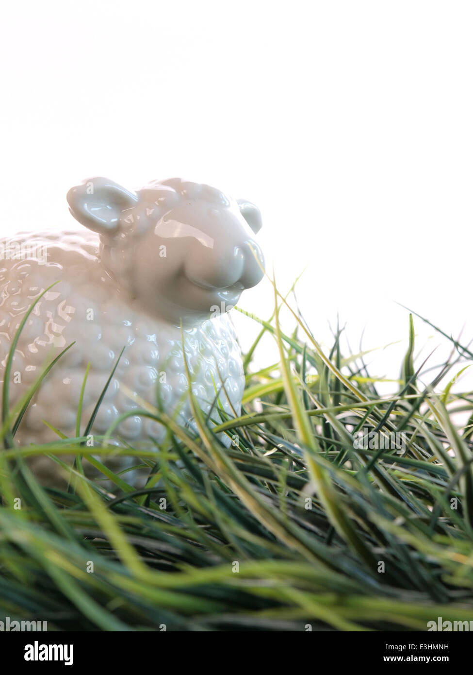Ceramic sheep on green grass Stock Photo - Alamy