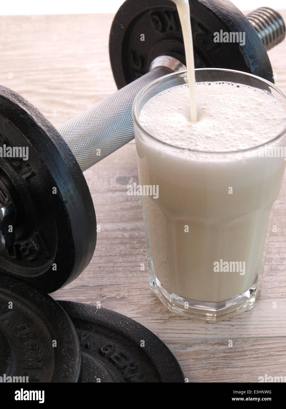 Fitness shake with dumbbells Stock Photo - Alamy
