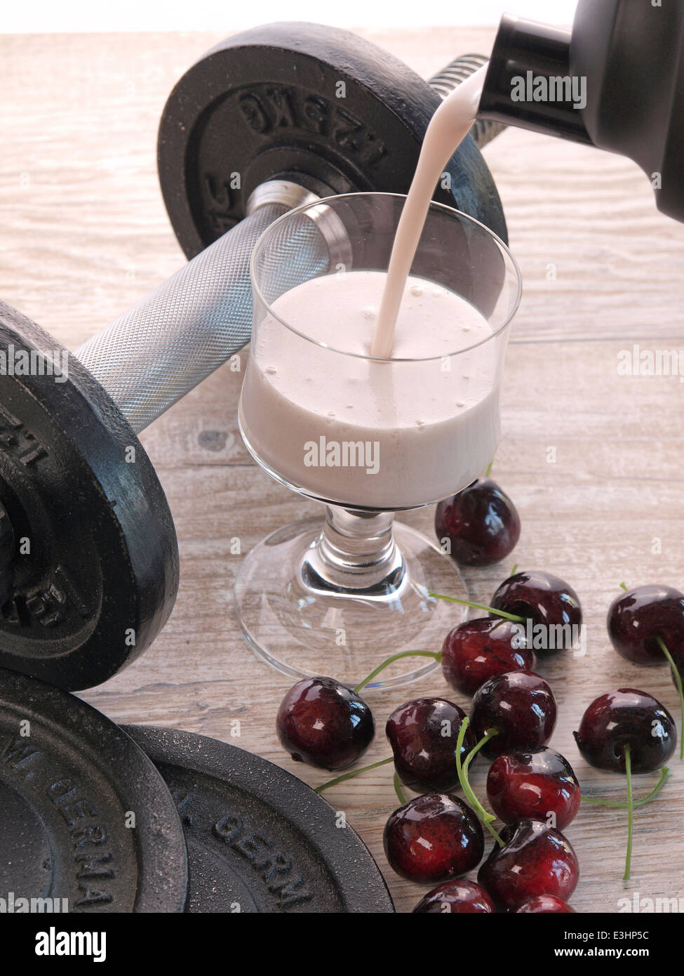Fitness shake with dumbbells Stock Photo - Alamy