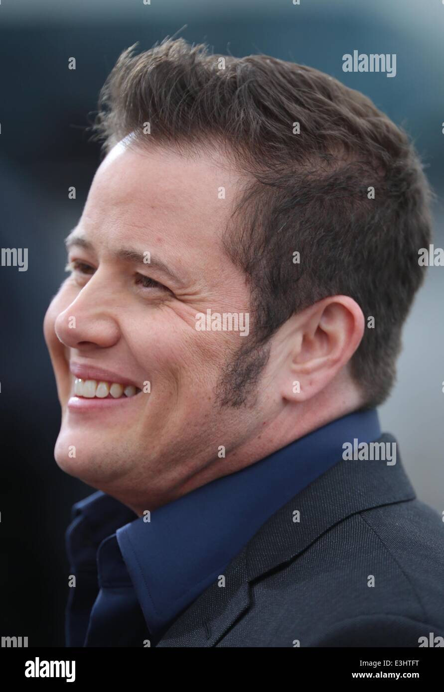 Chaz Bono appears on 'Extra' at Universal CityWalk and shows off his ...