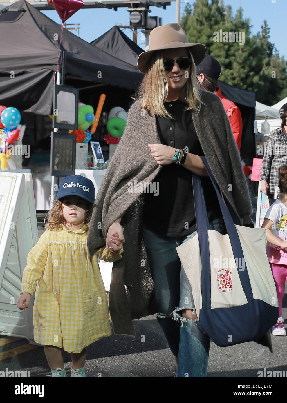 Actor Jason Schwartzman walks with his wife Brady Cunningham and ...