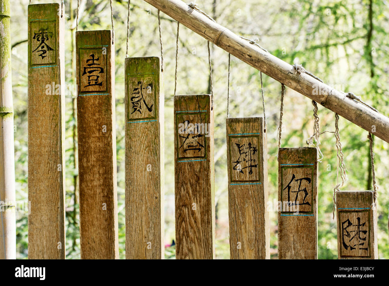 Wooden buddhist chimes in the eastern garden Stock Photo - Alamy