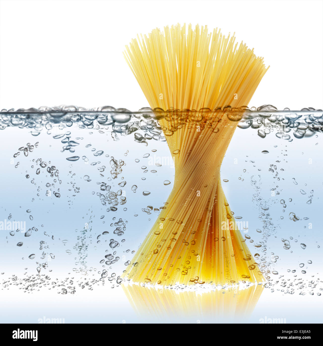 uncooked spaghetti in boiling water Stock Photo - Alamy