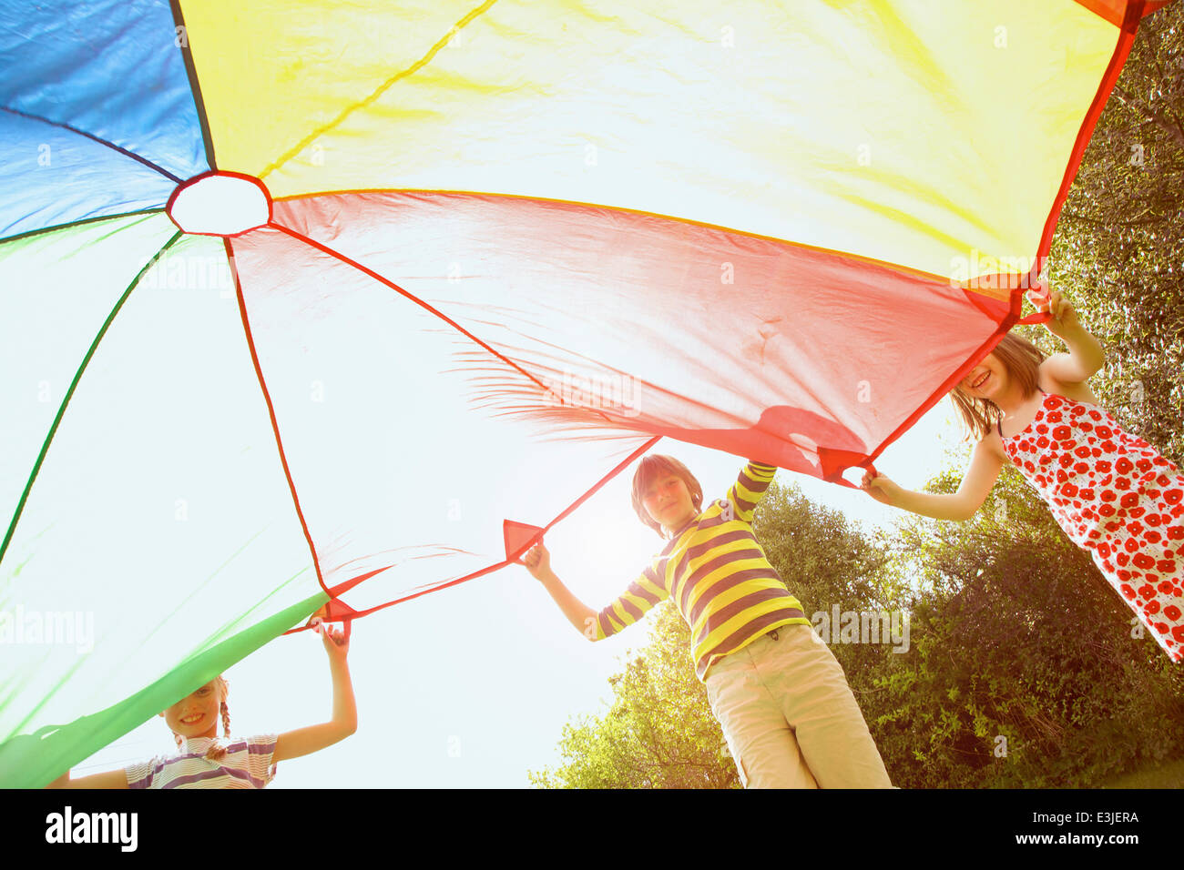 Three children under hi-res stock photography and images - Alamy