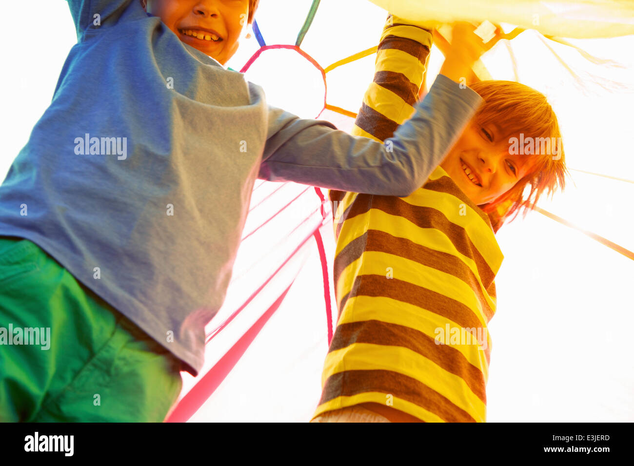 Children Playing under Parachute Stock Photo - Alamy