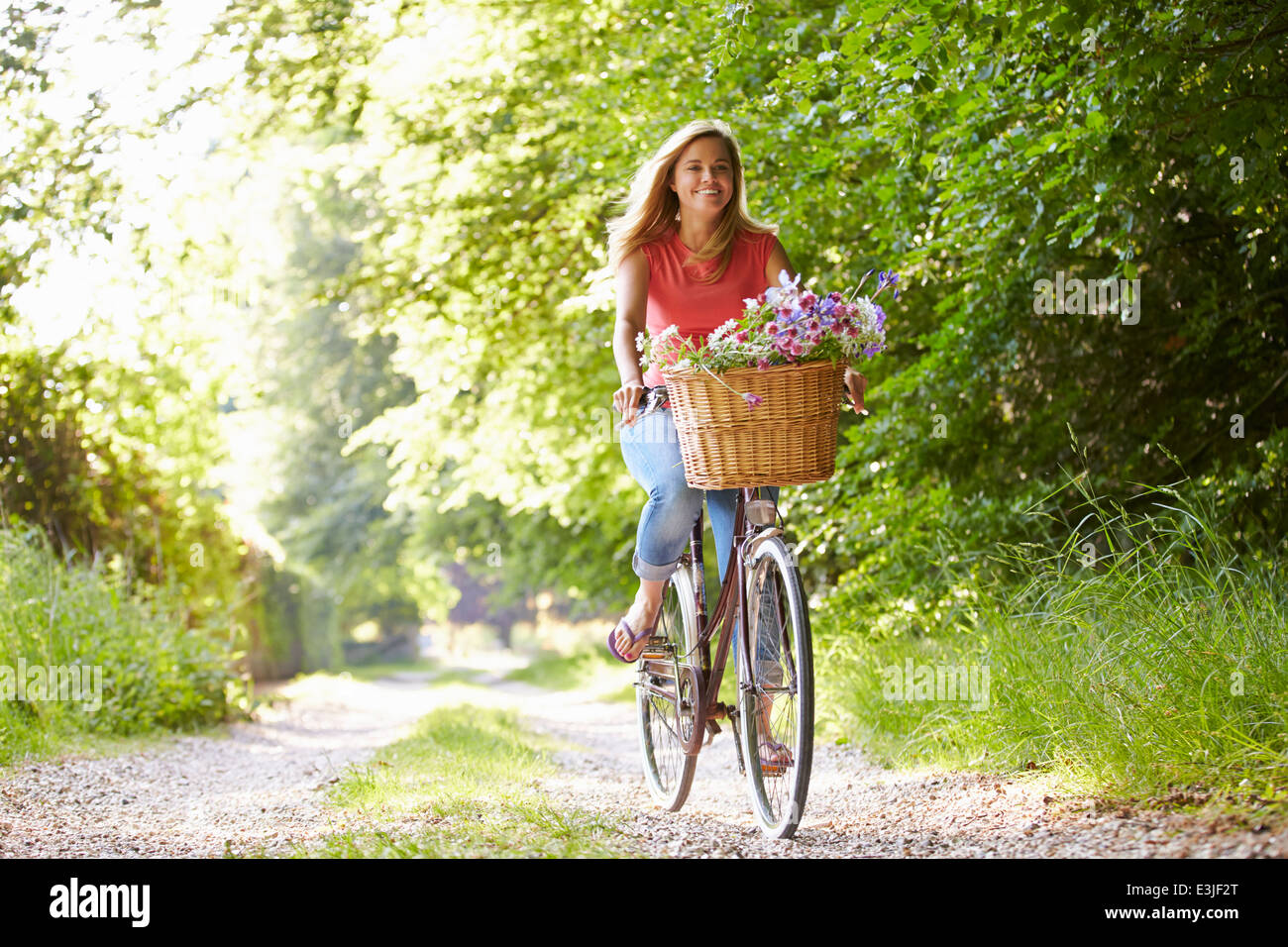 Woman On Cycle Ride In Countryside Stock Photo - Alamy