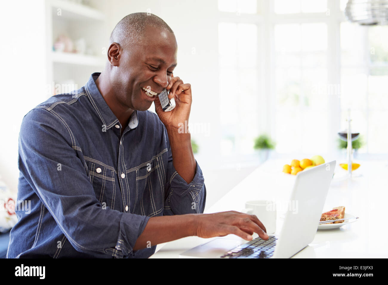 Middle aged man phone home hi-res stock photography and images - Alamy