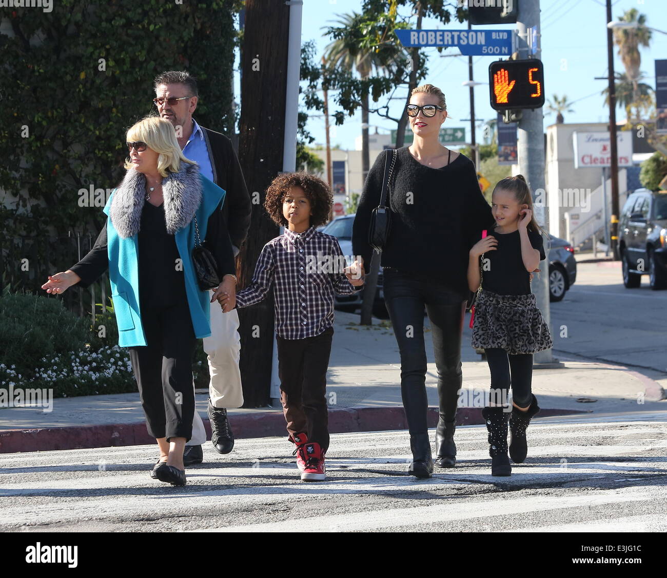 Heidi Klum and family with her parents Erna and Gunther, cross the road ...