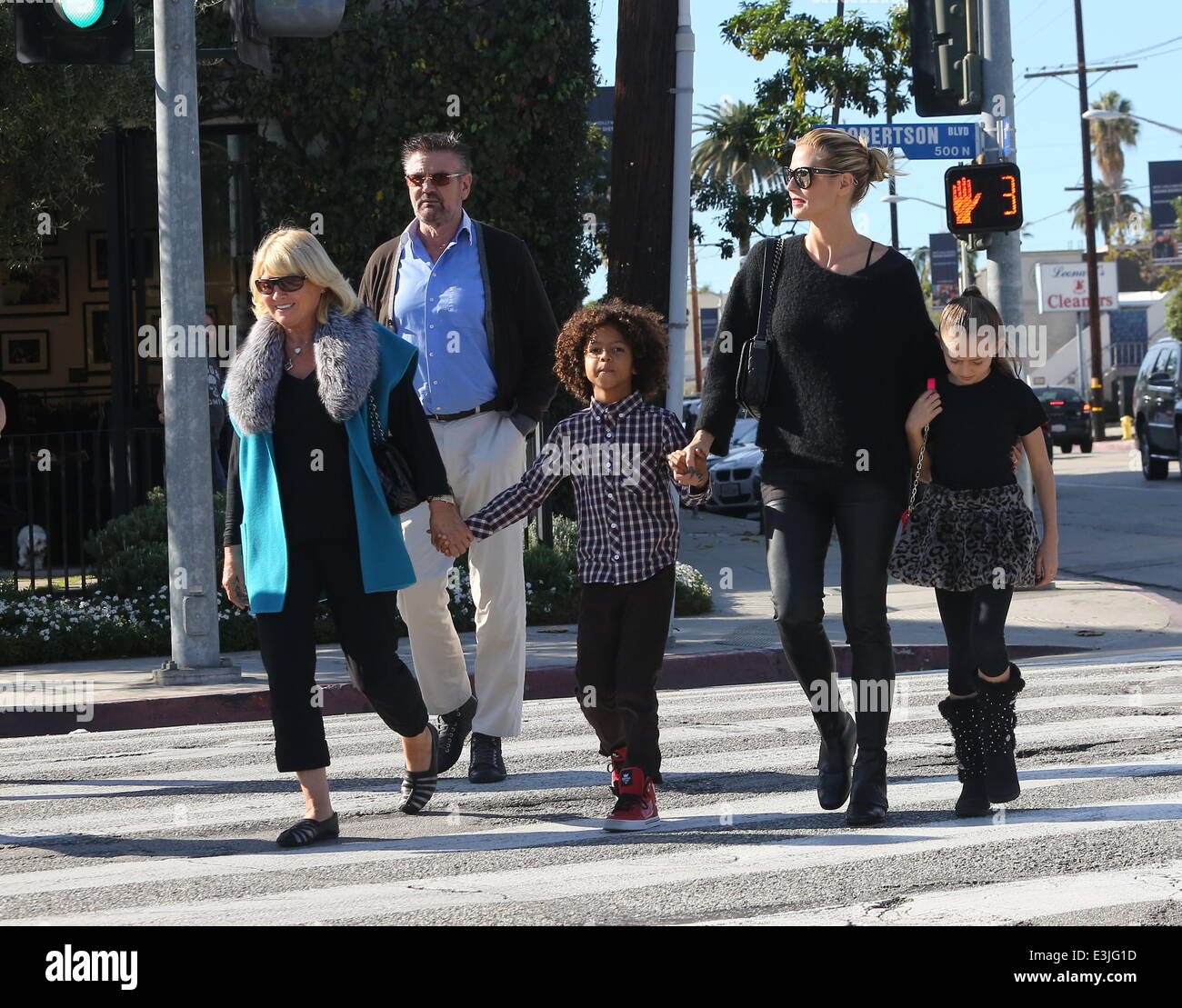 Heidi Klum and family with her parents Erna and Gunther, cross the road ...