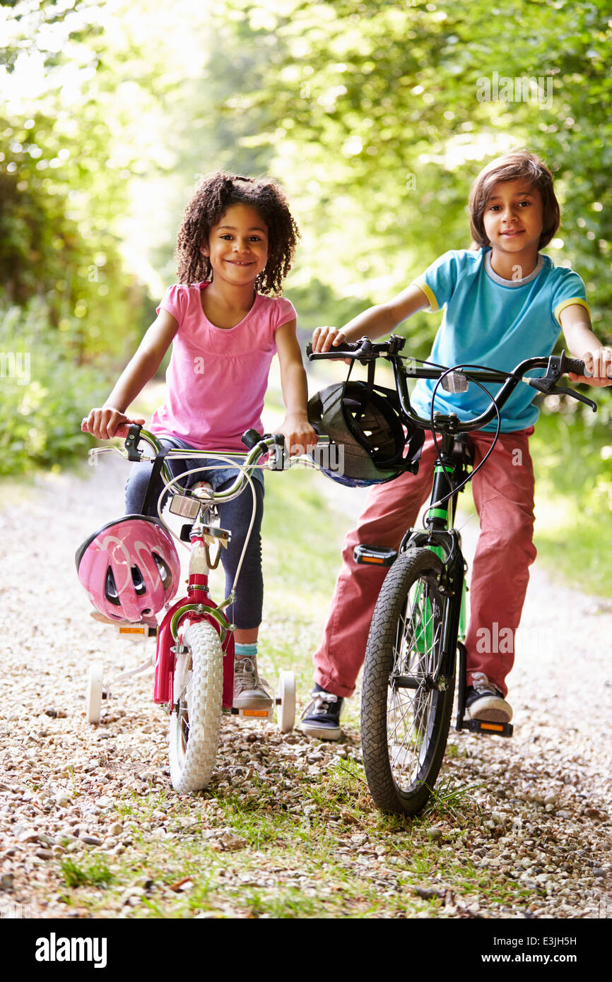 Two Children On Cycle Ride In Countryside Stock Photo - Alamy