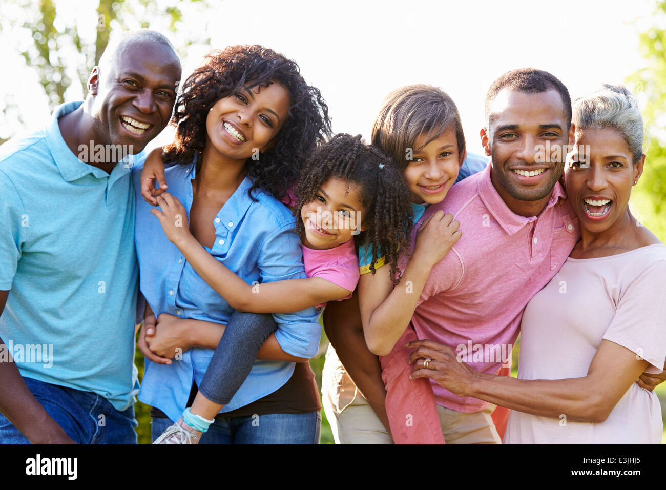 Multi Generation African American Family Standing In Garden Stock Photo ...