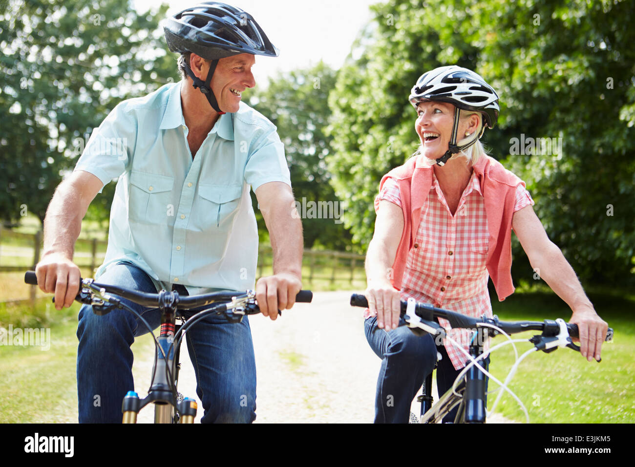 Middle Aged Couple Enjoying Country Cycle Ride Together Stock Photo - Alamy