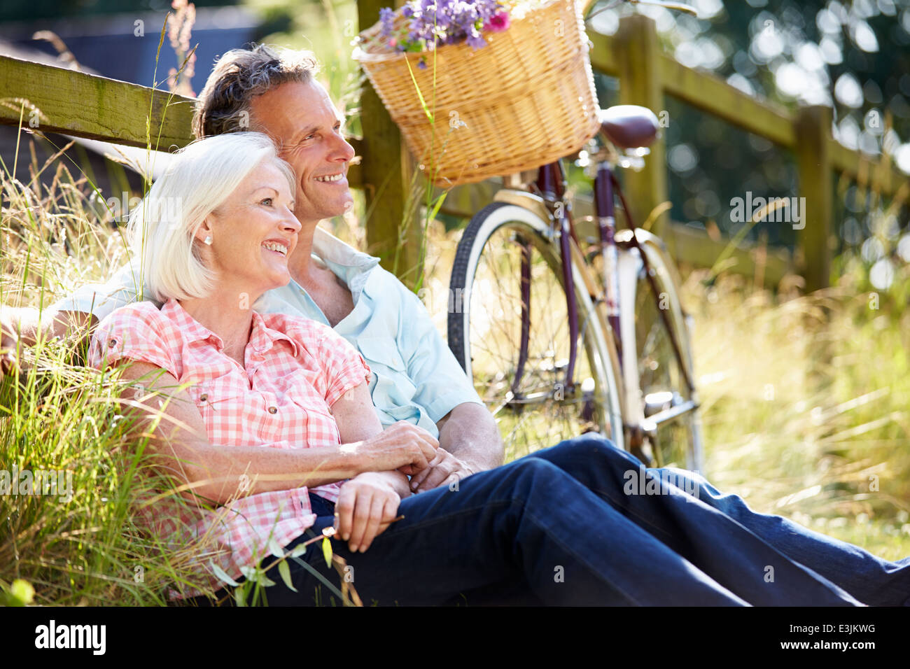 Middle Aged Couple Relaxing On Country Cycle Ride Stock Photo - Alamy