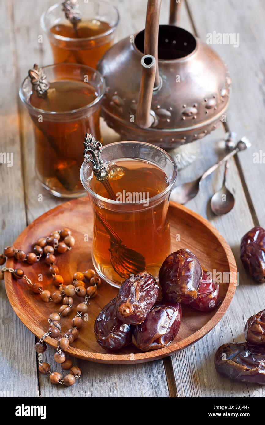Traditional arabic tea with wood beads, dry madjool dates and rock ...