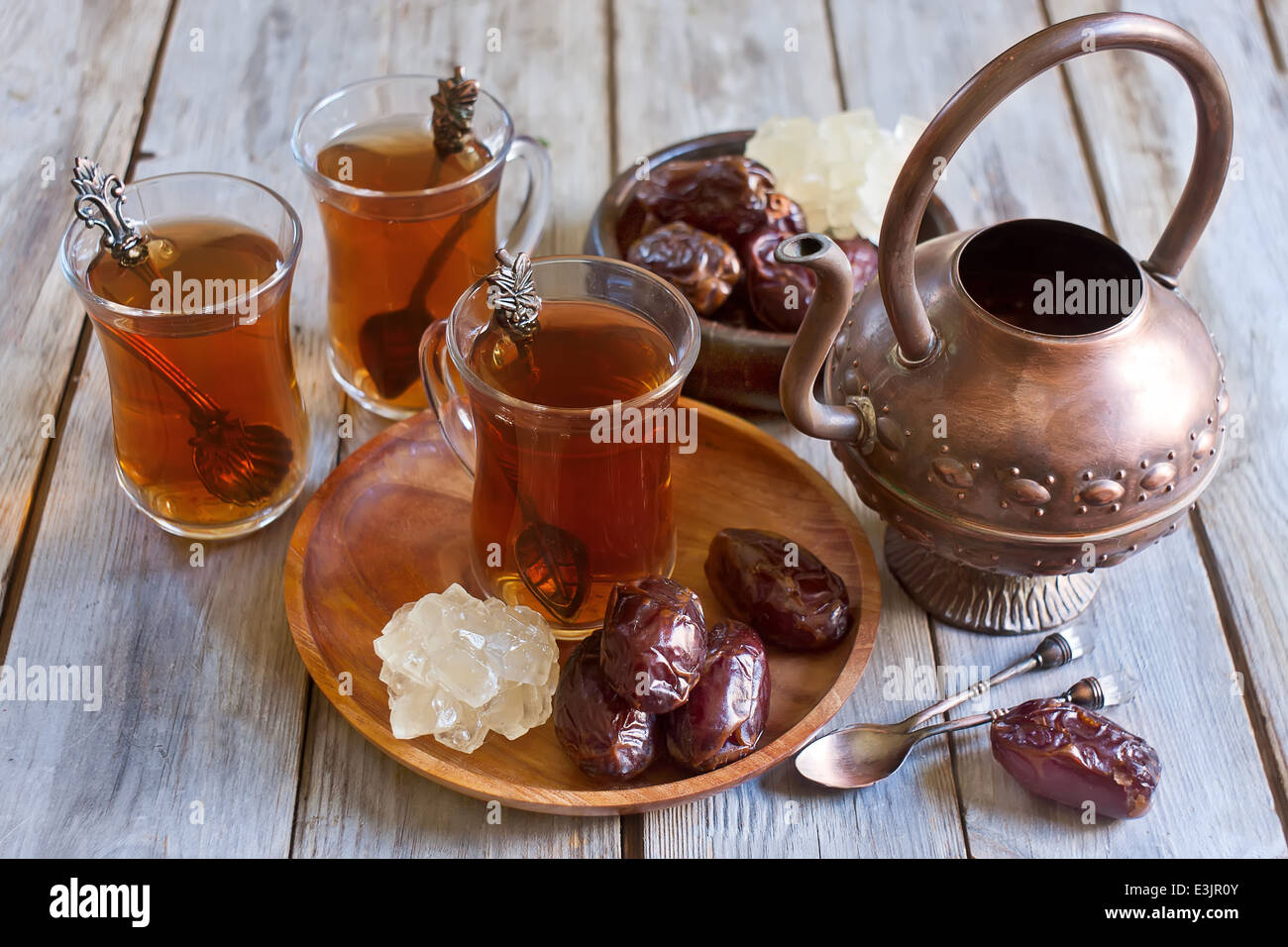 Traditional arabic tea with dry madjool dates and rock sugar nabot ...