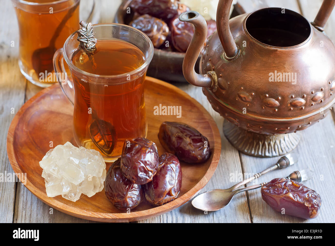 Traditional arabic tea with dry madjool dates and rock sugar nabot ...