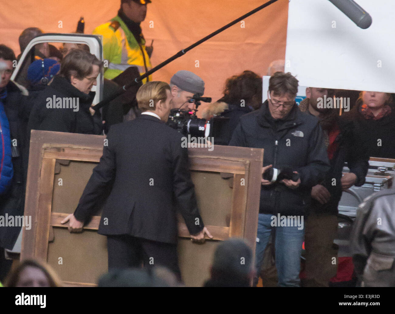 Johnny Depp on the set of his new movie 'Mortdecai' in London. The actor seen carrying a large ...