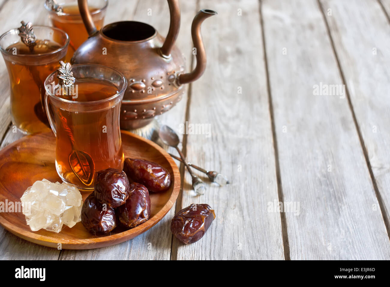Traditional arabic tea with dry madjool dates and rock sugar nabot ...