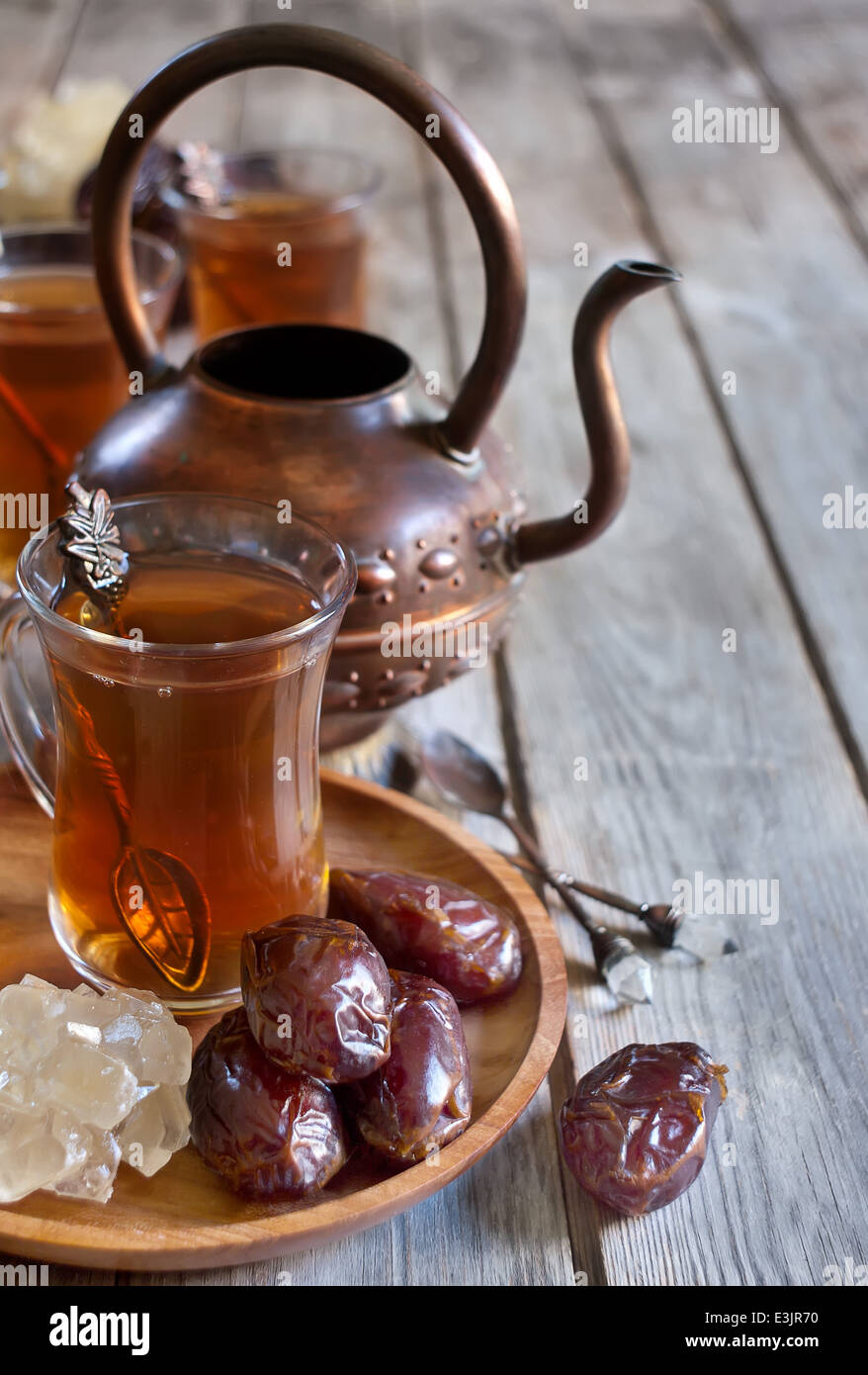 Traditional arabic tea with dry madjool dates and rock sugar nabot ...