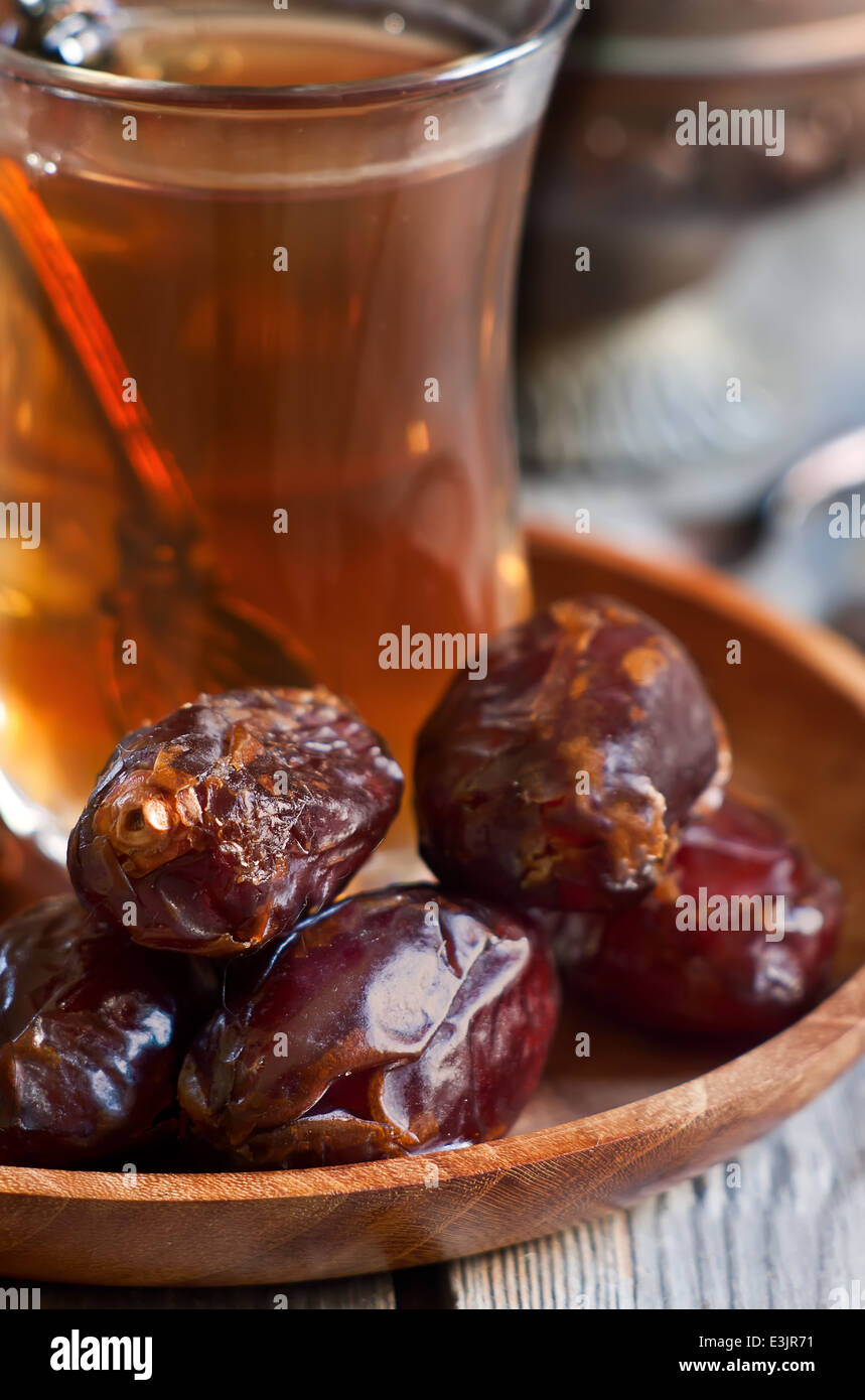 Traditional arabic tea with dry madjool dates and rock sugar nabot ...