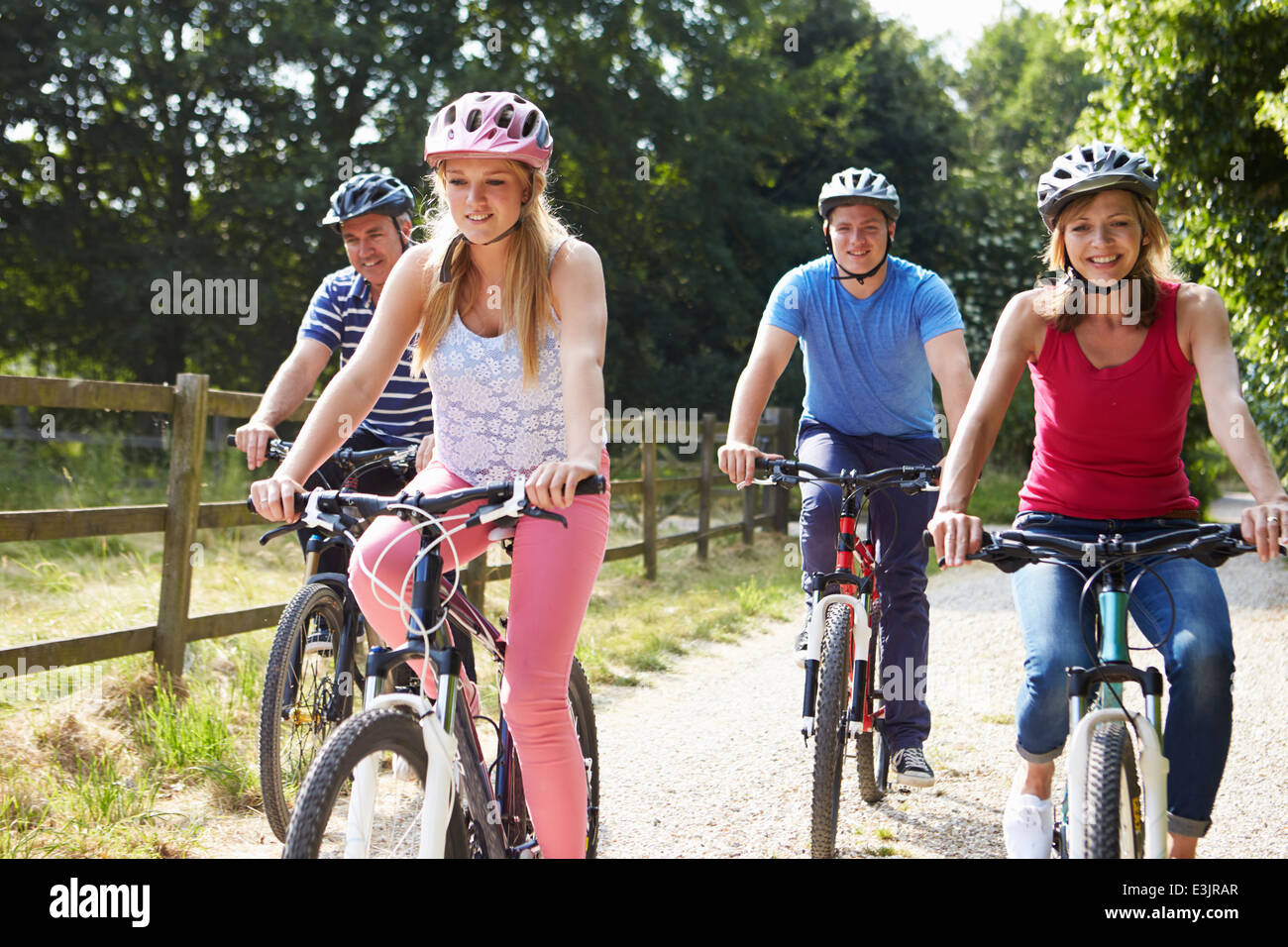 Family With Teenage Children On Cycle Ride In Countryside Stock Photo ...
