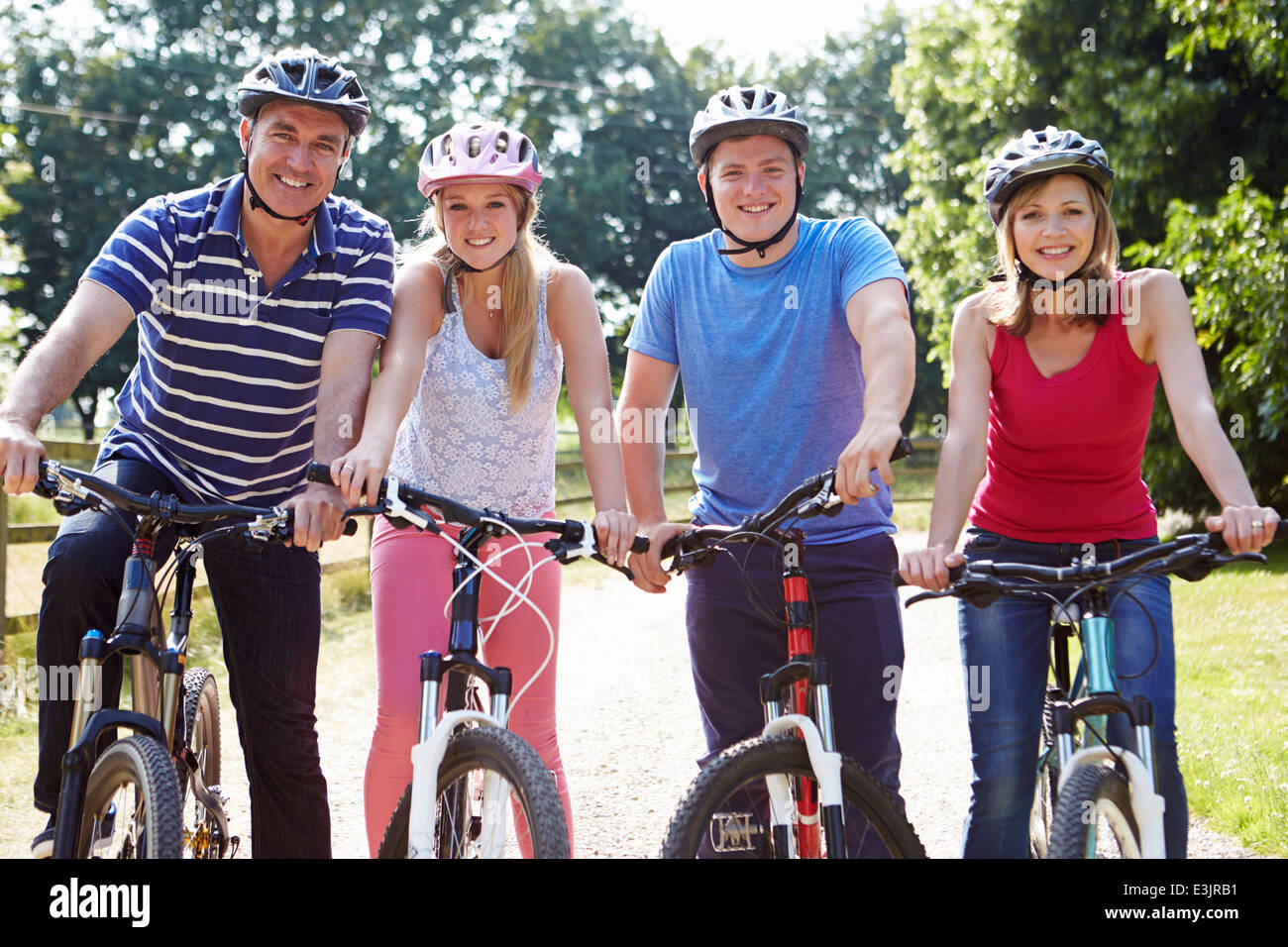 Family With Teenage Children On Cycle Ride In Countryside Stock Photo ...
